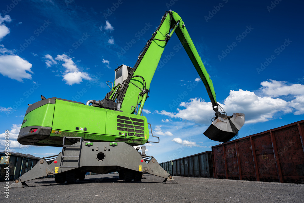 Loading of coal and coke into wagons at the reloading terminal with the ...