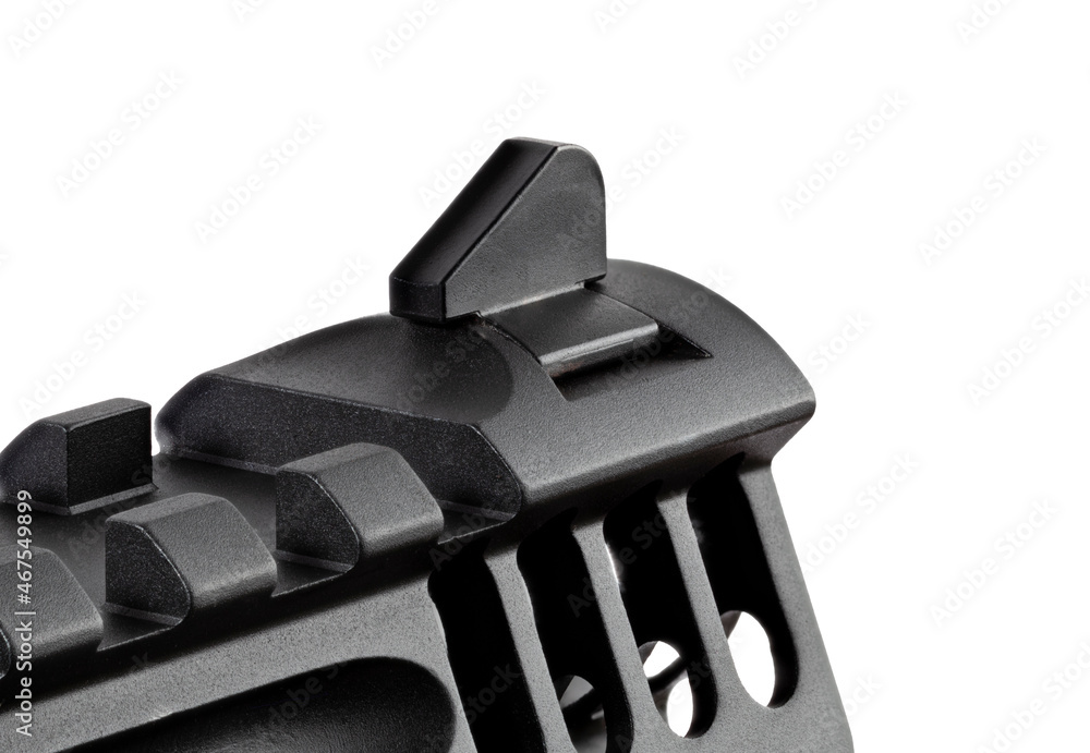 Angled view of the front sight and ports on a semi-automatic handgun ...