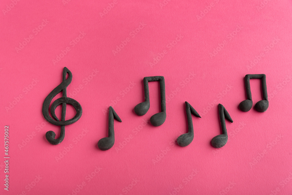 Treble clef and music notes on pink background. Music symbol. Key of G ...