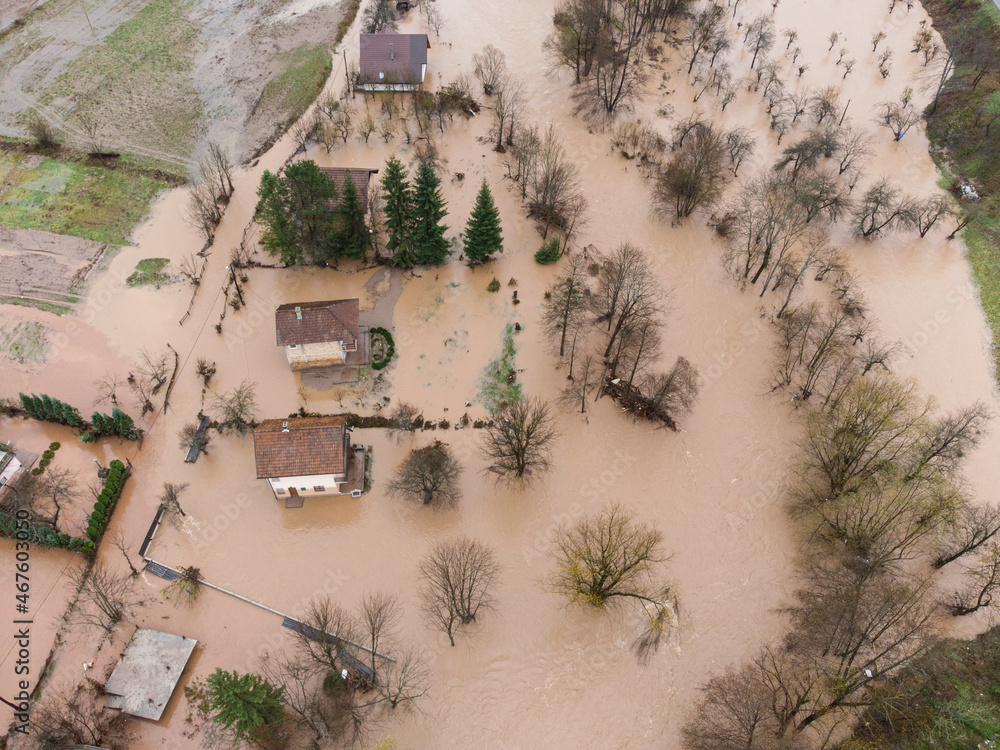 Aerial drone viwe of flooded villages, fields, farms and houses ...