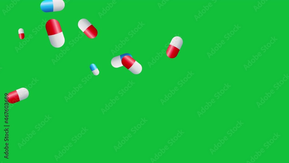 Pills and capsules rain down on a green screen (chroma key) background ...