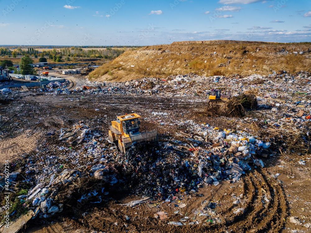 Garbage dump and working dump truck and bulldozer, aerial view Stock ...