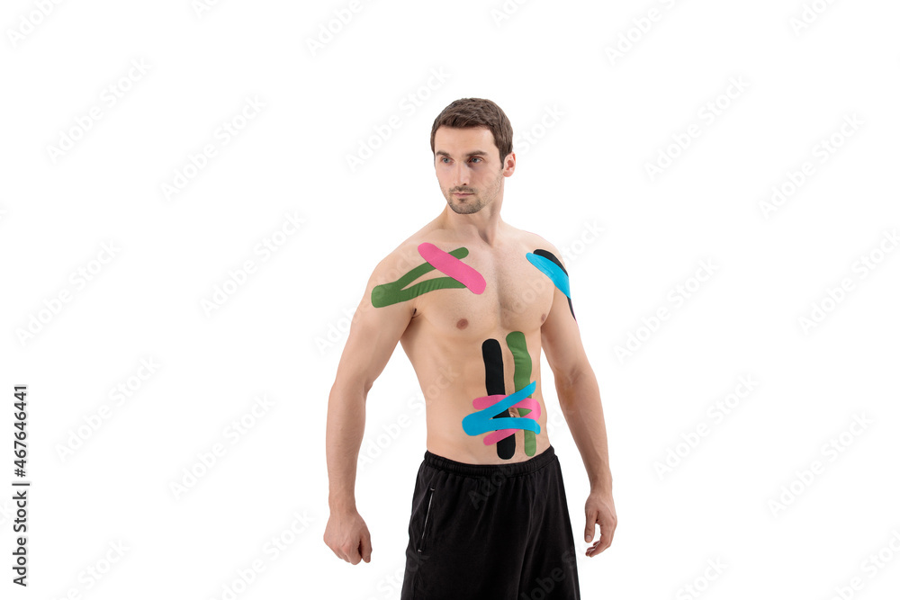 Male athlete with kinesio tape on the abdominal muscles and on the ...