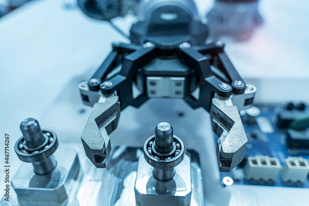 robotic arm catch for electronic assembly line. The robot for smart ...