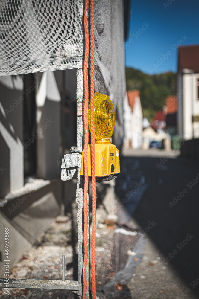 Warning and construction light on the scaffolding Stock Photo | Adobe Stock