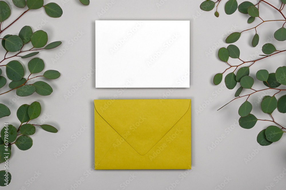 Blank white Invitation card with yellow envelope, with eucalyptus ...