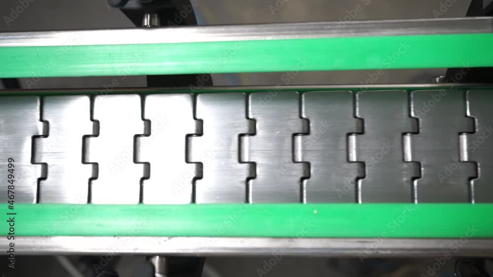 Moving metal plate conveyor. Part of the conveyor Stock Video | Adobe Stock