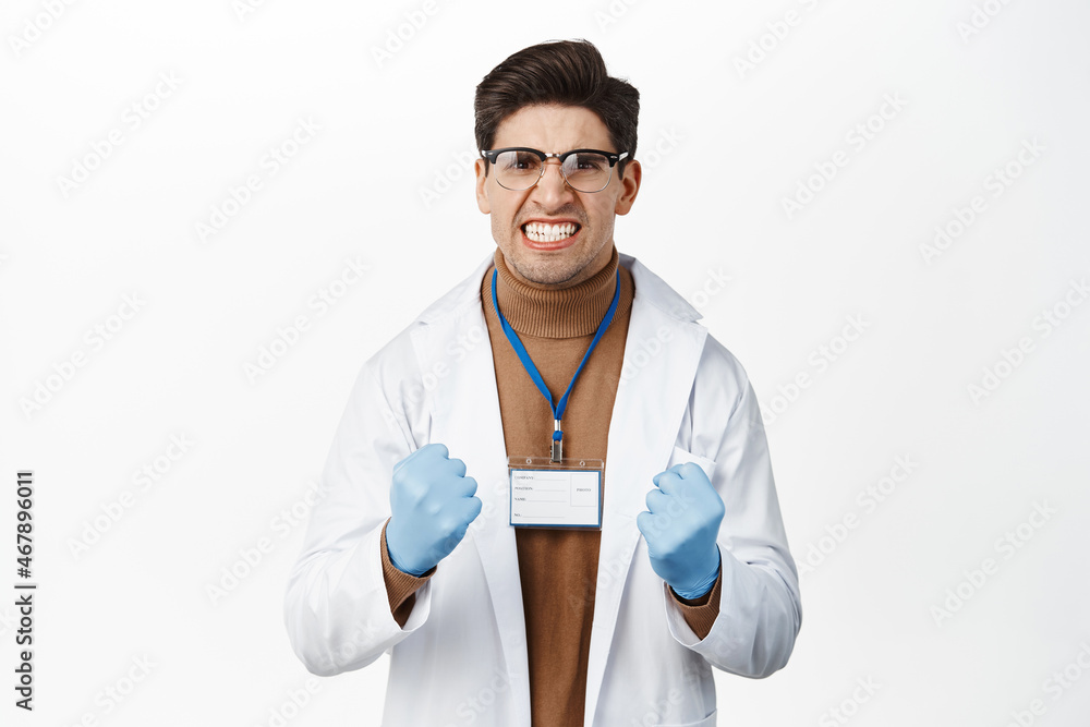 Angry doctor clench teeth and fists, looking pissed-off furious ...