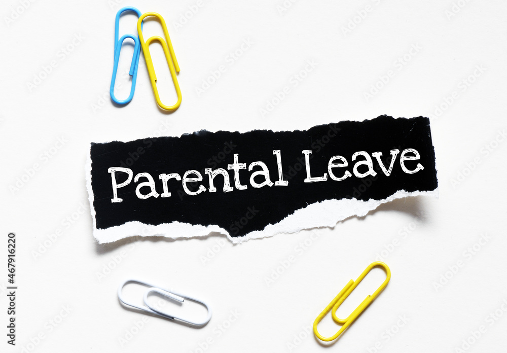 PARENTAL LEAVE words written on a black piece of paper. Concept for ...