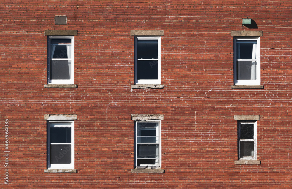 Old and run down brick building and windows facade Stock Photo | Adobe ...