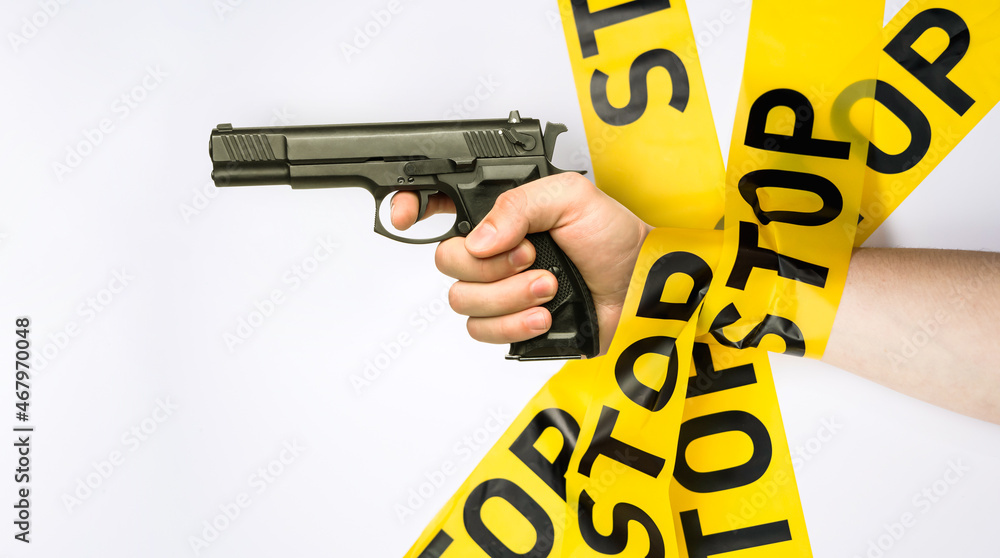 Hand holding a gun. The method of stopping the war. Security measures ...