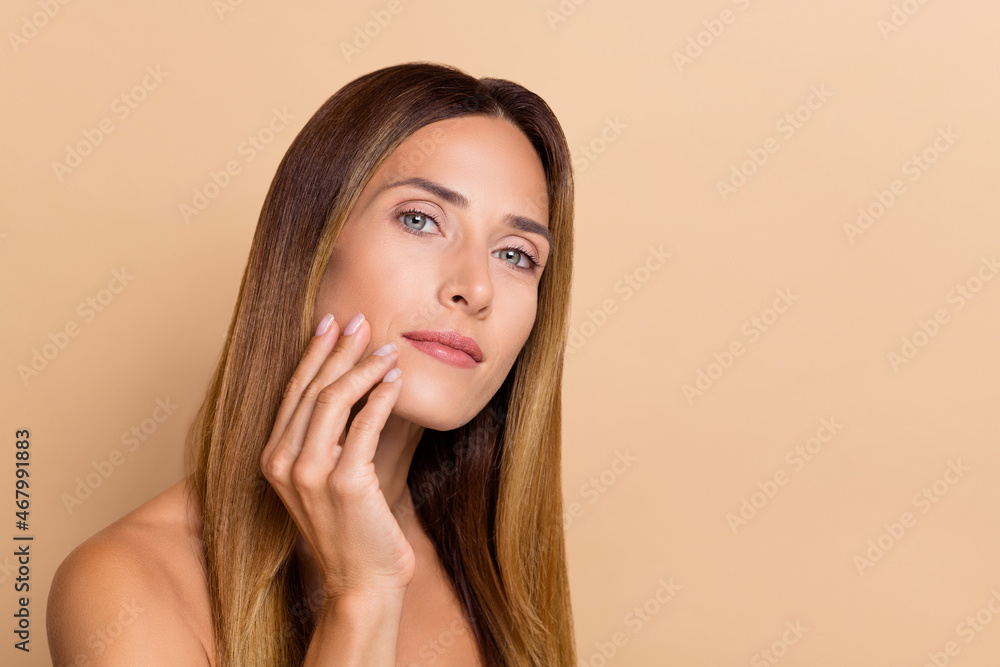 Portrait of attractive brown-haired woman touching shine perfect tone ...
