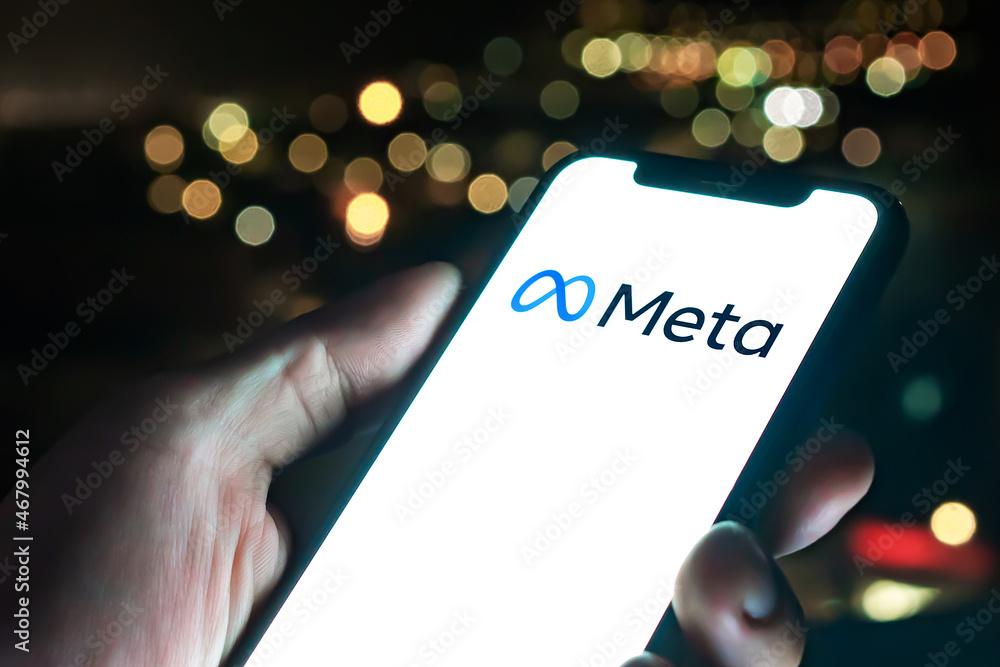 Malaga, Spain - 30 October 2021: Meta logo in mobile phone held by a ...