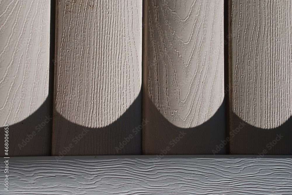 Light-colored plastic wadding element. The joint of several siding ...