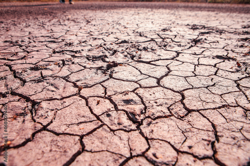 Cracked red earth during drought, the texture of earth during drought ...