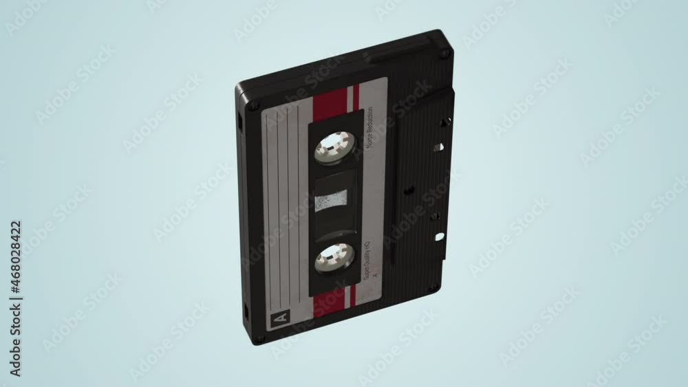Compact audio cassette rotation, white background. Old school, 80s, 90s ...