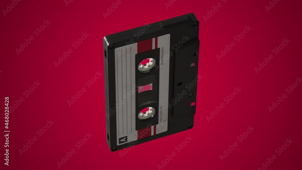 Compact audio cassette rotation, red background. Old school, 80s, 90s ...