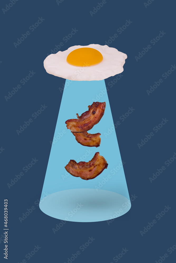 Fanny breakfast made with UFO fried egg and bacon abduction. Stock ...