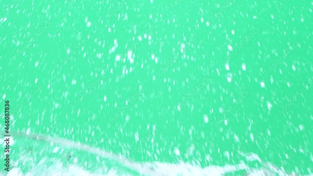 Slow motion of water spash with drops over green screen chroma key ...