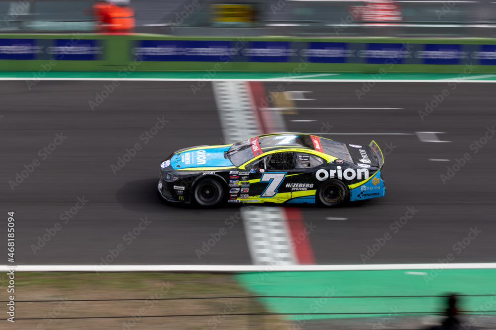 Nascar racing car crossing finish checkered line blurred motion ...