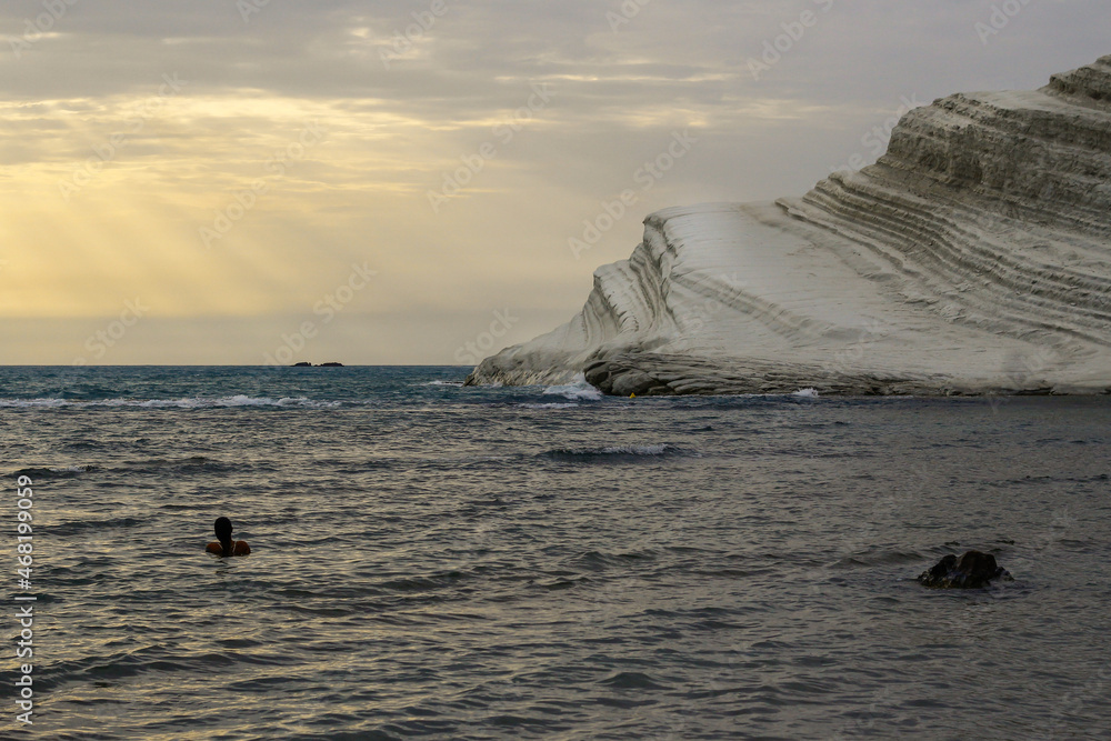 Girl having bath at the sunset in Scala dei Turchi, Realmonte ...