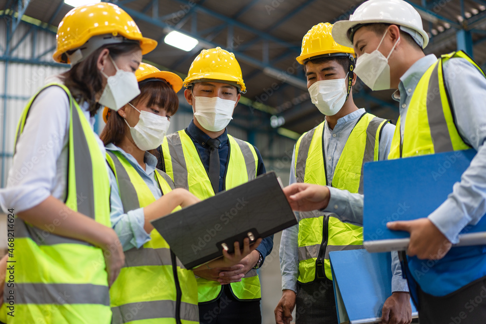 Group of Asian male and female engineers wearing hygienic mask protect ...