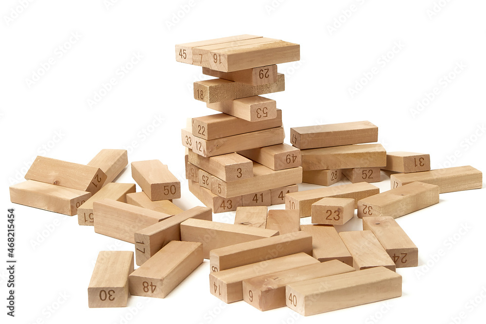 The fallen tower from the wooden blocks of the game Jenga Tower on a ...
