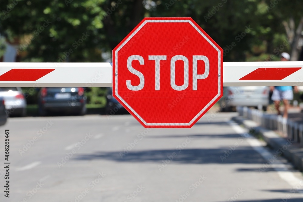 Stop sign on the barrier gate Stock Photo | Adobe Stock