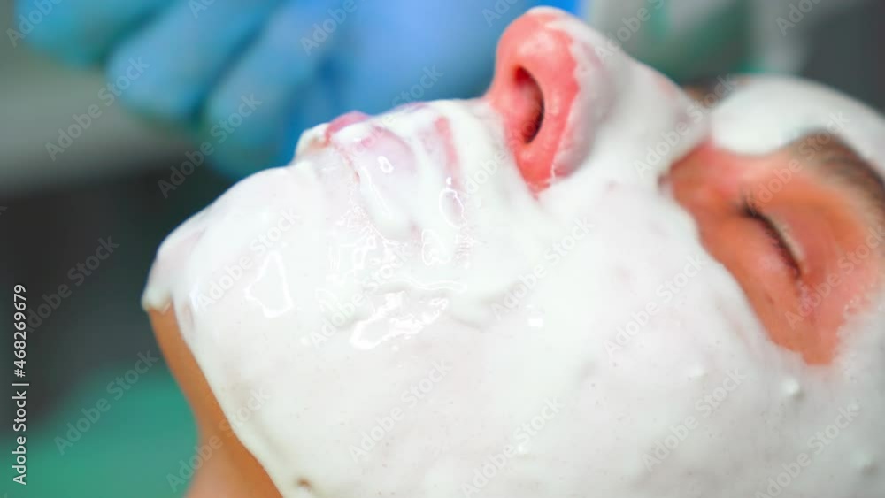Beauty clinic concept. Young woman getting professional facial ...