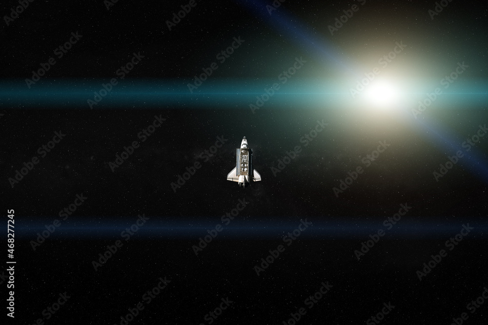 Space shuttle in outer space in a front of te Sun wit lens flare ...
