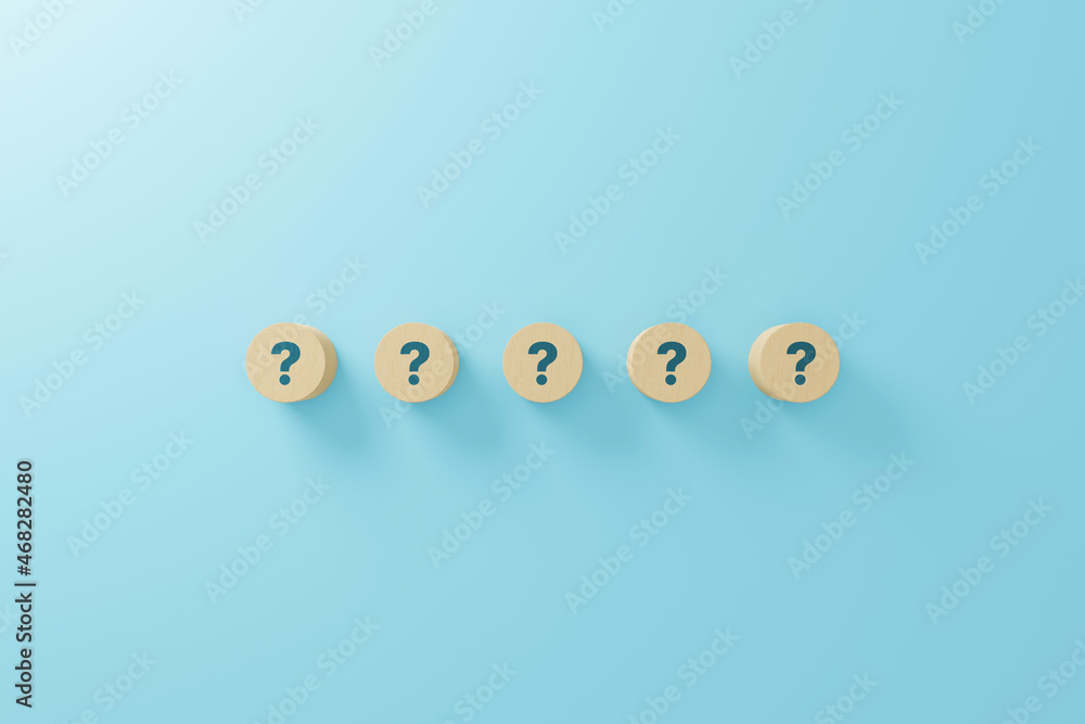 Wooden block shape with sign question mark symbol on blue background ...