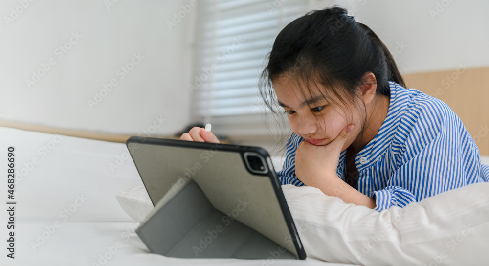 Asian girl children using laptop computer tablet , studying through ...