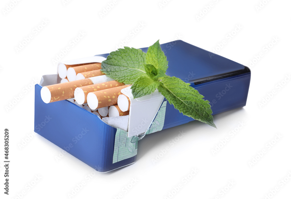Pack of menthol cigarettes and fresh mint leaves on white background ...