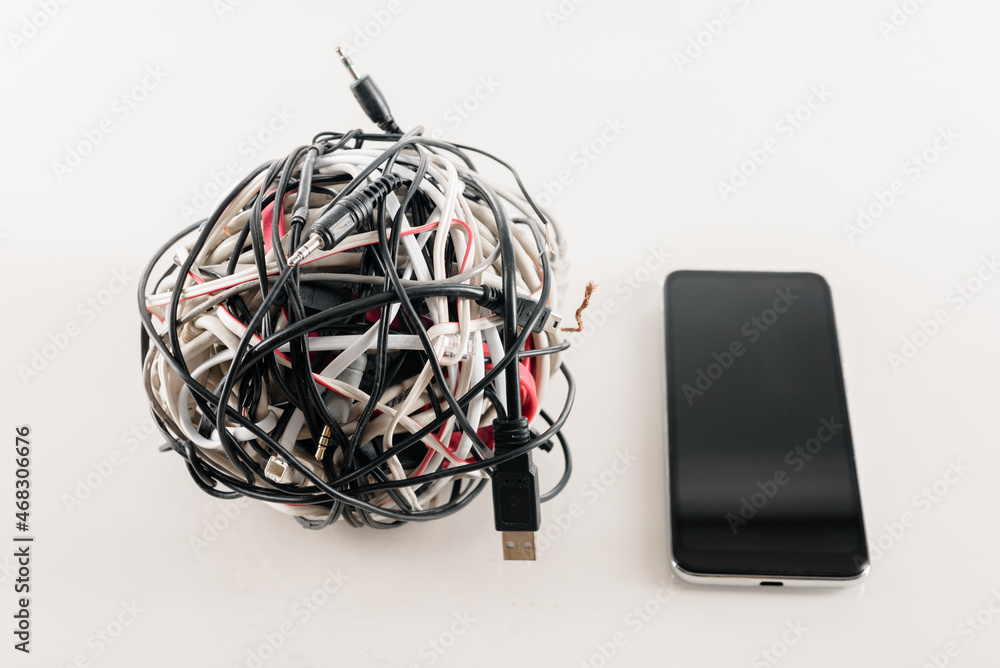 Poster Modern mobile phone with messy bunch of different cables, future ...