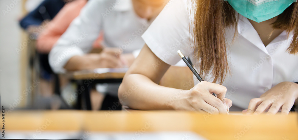 high school,university student study.hands holding pencil writing paper ...