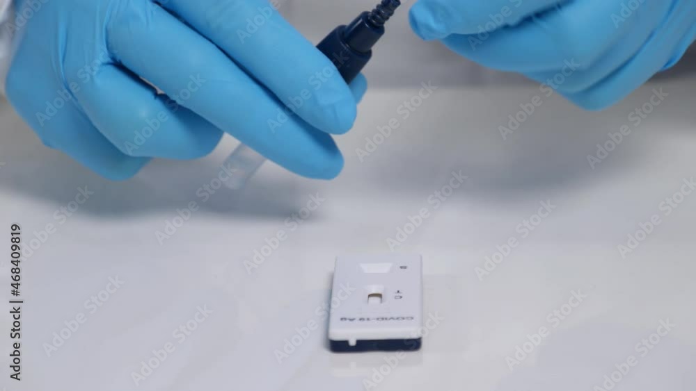 doctor in PPE suit holding Coronavirus(Covid-19) negative test result ...