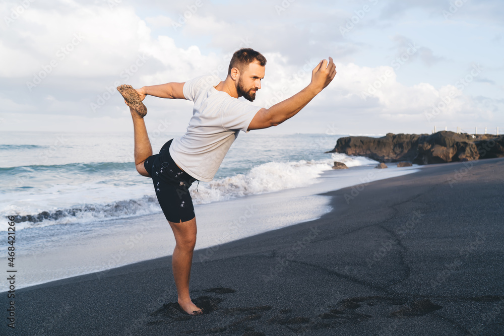 Caucasian man athlete with perfect pumped up figure recreating doing ...