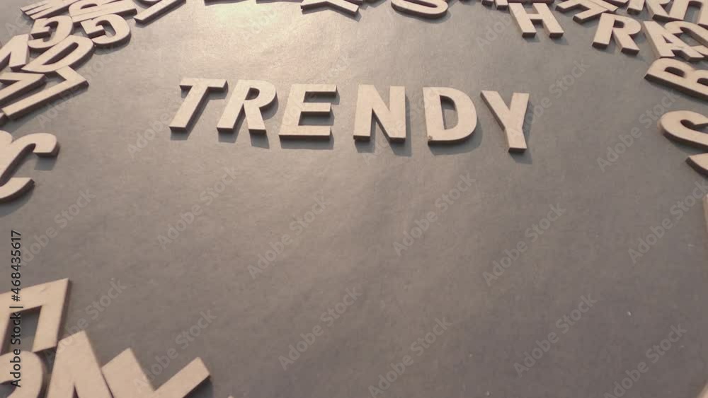 Vidéo Stock Trendy Word In Wooden Cube Alphabet Letters Top View On A ...