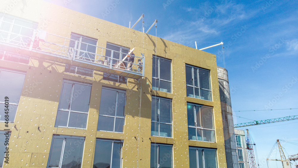 Building external wall thermal insulation with mineral wool. Exterior ...