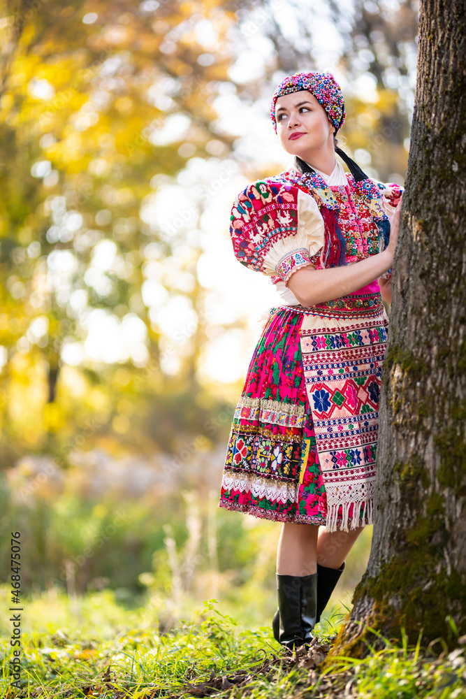 Young beautiful slovak woman in traditional dress. Slovak folklore ...