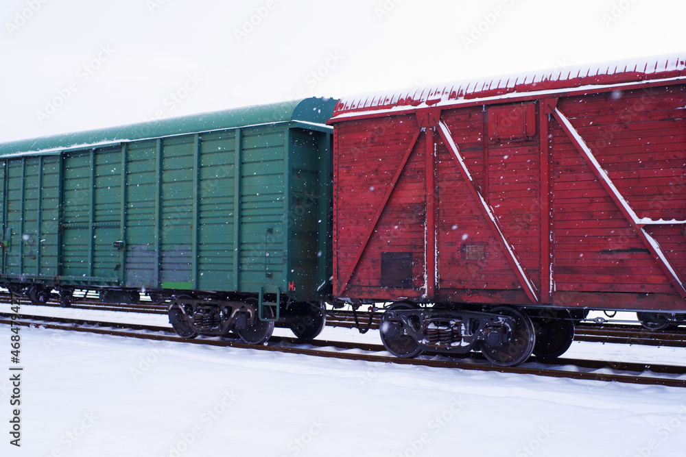 Freight wooden wagons of freight train at railway station in winter ...