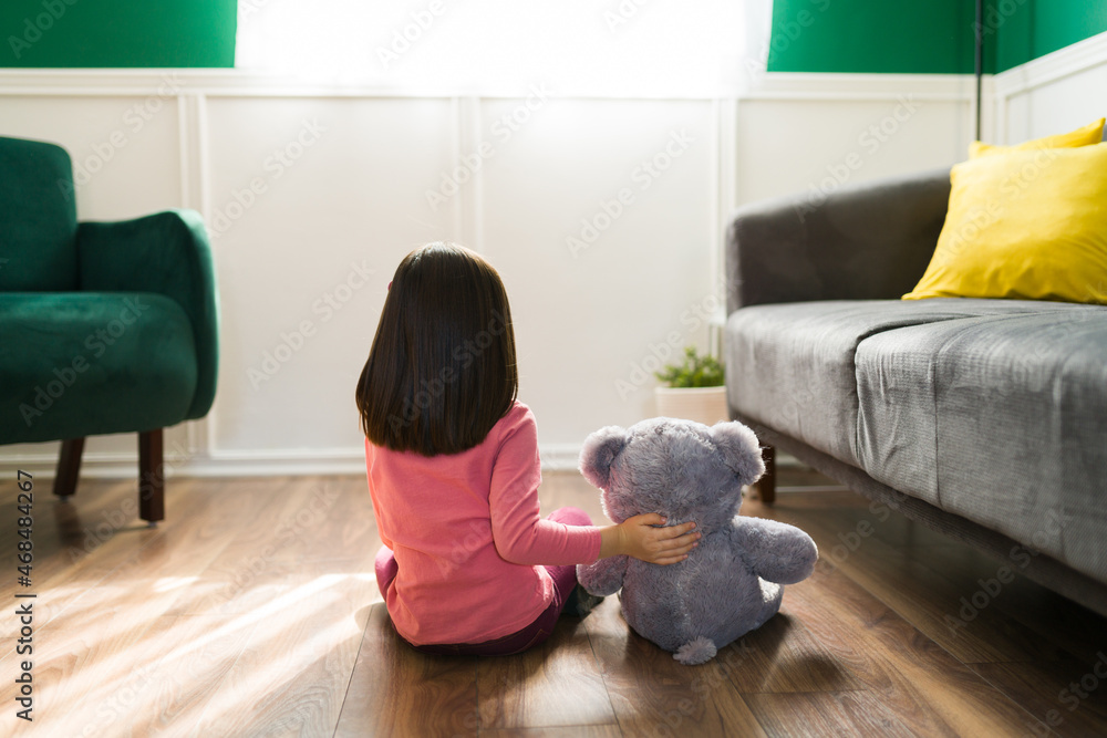 Rear view of a depressed young kid Stock Photo | Adobe Stock