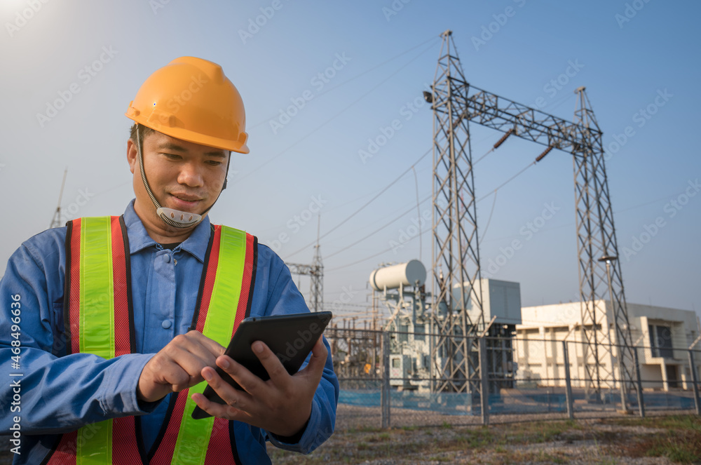 Happy electrical substation engineer inspect modern high-voltage ...