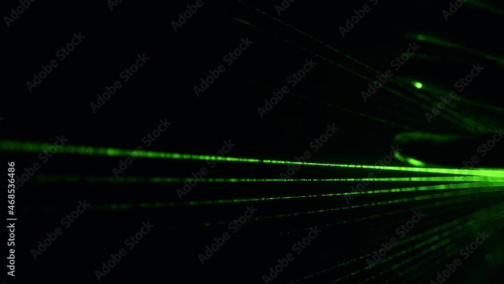 Dust particles in green laser light beam from diffraction grating ...