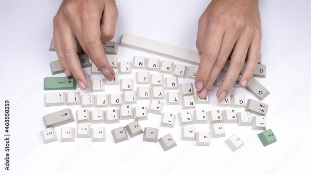 loose keyboard keys with hands typing Stock ビデオ | Adobe Stock