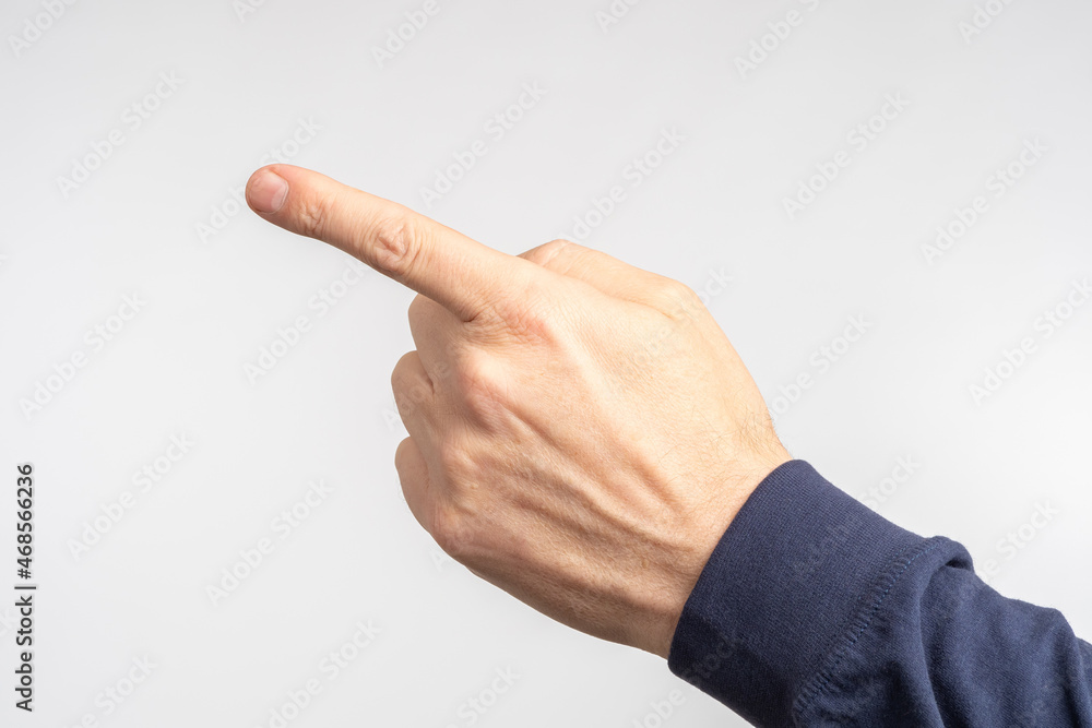 Male hand close up. Person points direction with his finger. Index ...