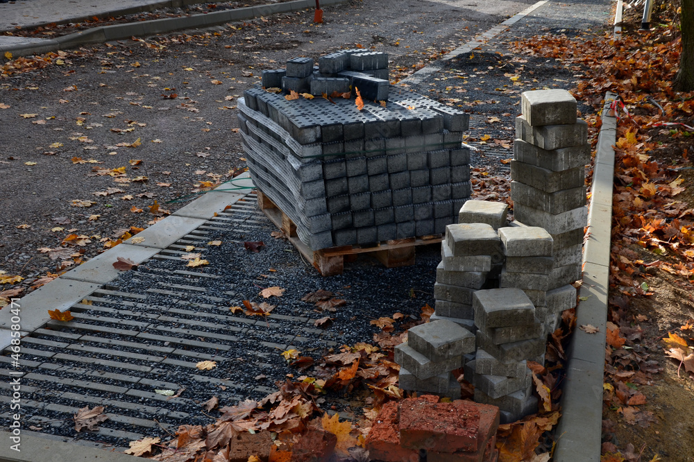 construction of new residential area roadway. parking spaces are made ...