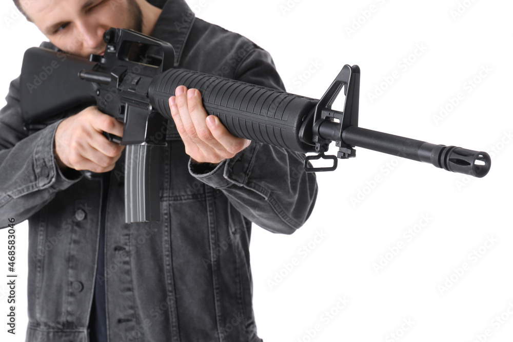 Assault gun. Man aiming rifle against white background, focus on barrel ...