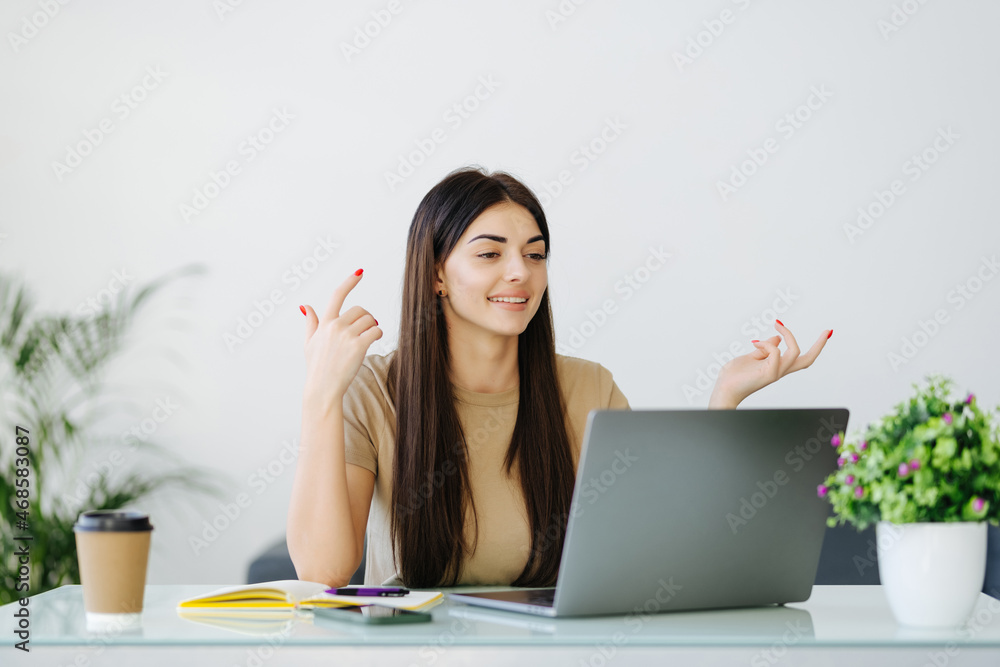 Surprised woman looking computer screen indoor. Excited girl chatting ...