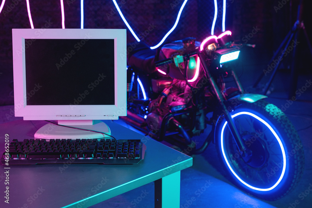 Blank screen computer monitor with copy space on the foreground of neon ...